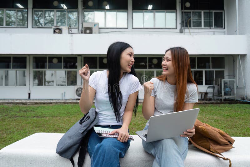 Motivation and Collaboration. Two Students Cheerfully Discussing Their ...