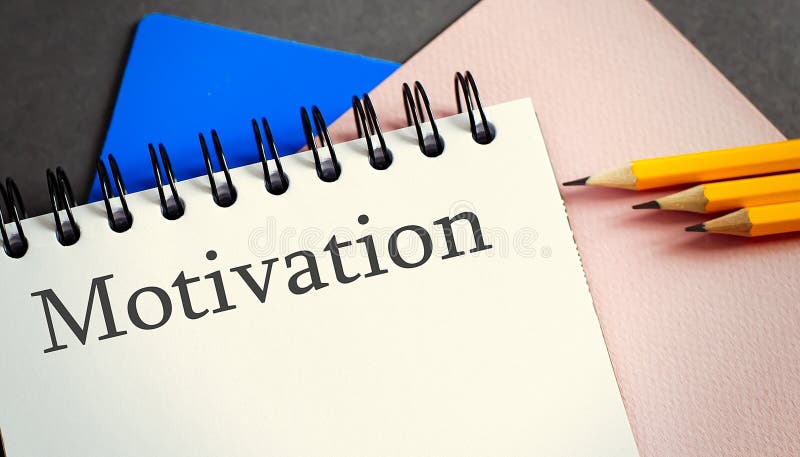 MOTIVATION Text in the Office Notebook with Office Tools Stock Image ...