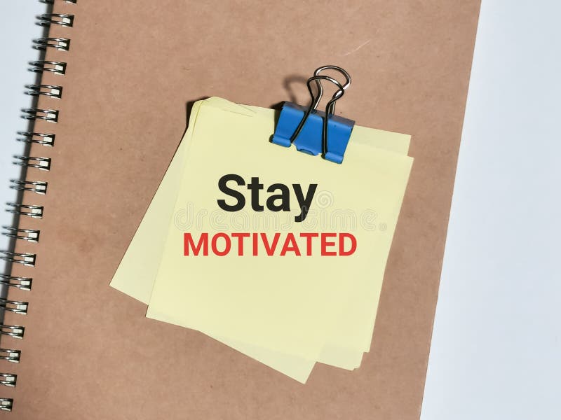 Motivation Words. Text Stay Motivated Written on Notepad with a Note ...