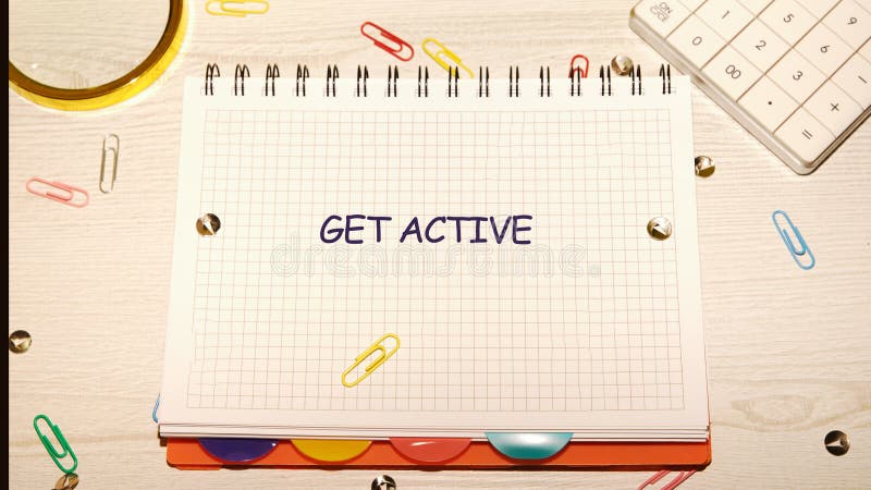 A Motivational Note Reading Get Active is Placed on a Spiral Notebook ...