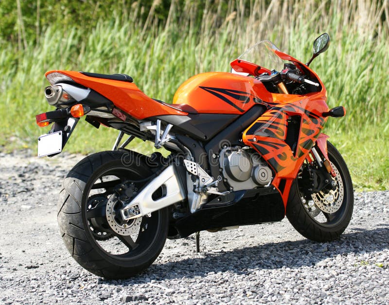 Moto photo stock. Image du piloter, motocyclette, orange - 10114118