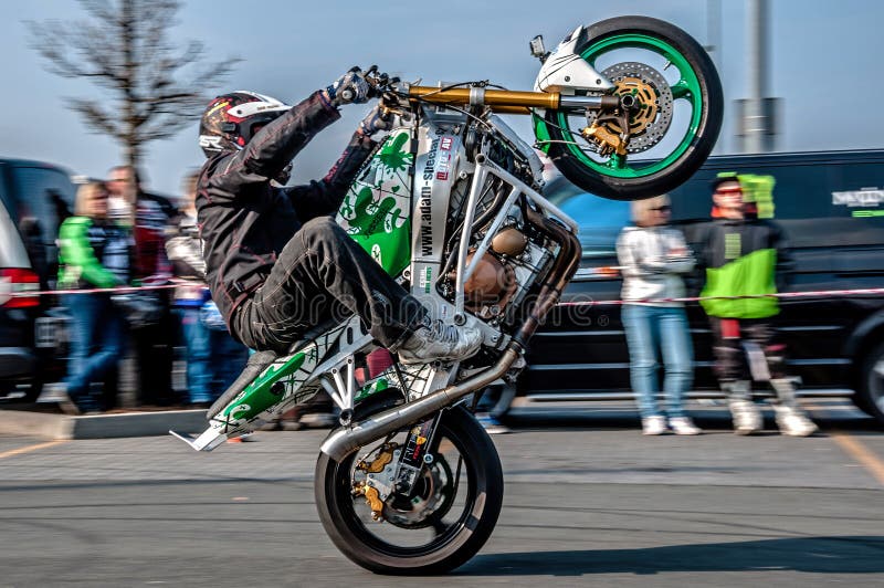 Moto stunt-riding wheelie editorial photo. Image of risk - 24599561