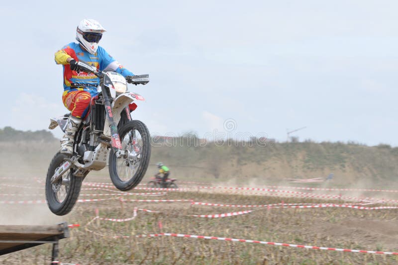 Motocross driver at ramp editorial stock photo. Image of jump - 60024053