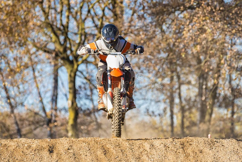 Motocross scene on a trail stock image. Image of jump - 104737785