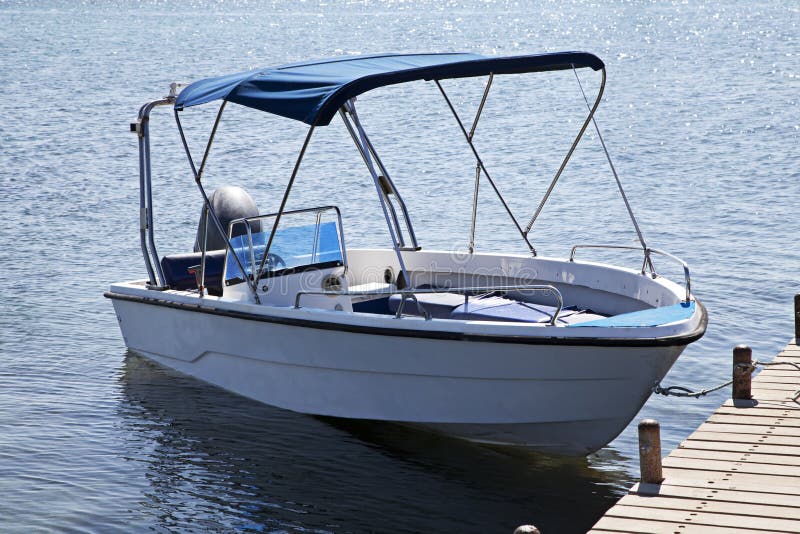 Motor boat on jetty stock photo. Image of cruise, boat - 21826270