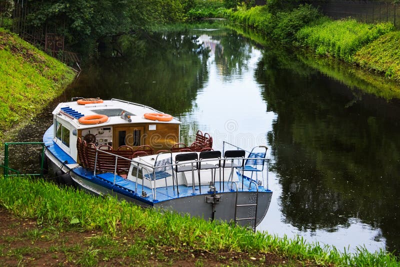 Motor Boat on the Still Water Stock Photo - Image of grass, motor: 20412290