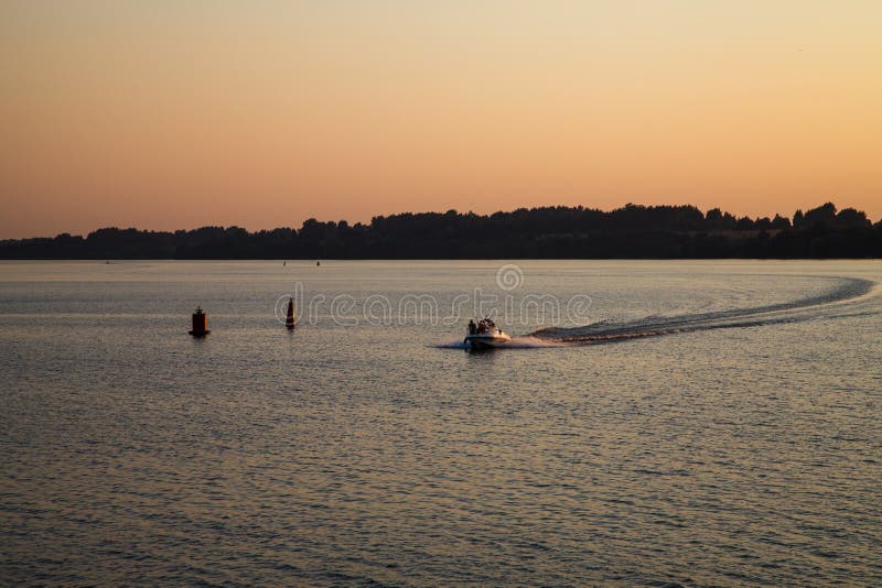 The motor boat at sunset stock photo. Image of motor - 81891254