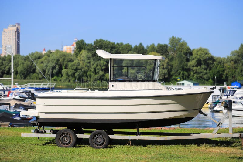 Motor Boat on a Trailer on the Shore Stock Photo - Image of transport ...