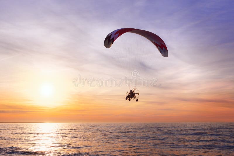 Motor Glider Flying Over the Sea during Sunset Stock Image - Image of ...