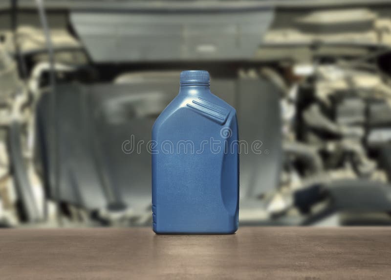 Motor Oil in Blue Container on Grey Table Stock Photo - Image of ...