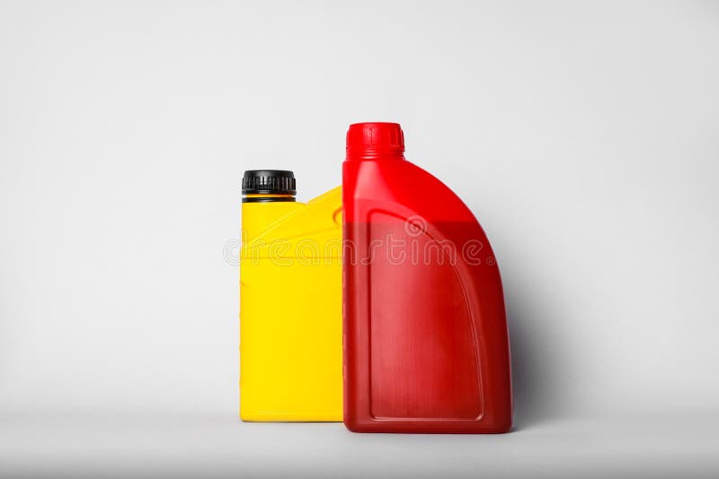 Motor Oil in Different Canisters on Light Background Stock Image ...