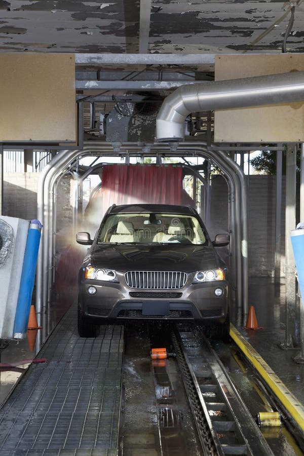 Motor Vehicle Going through a Cleaning Process in Car Wash Stock Image ...