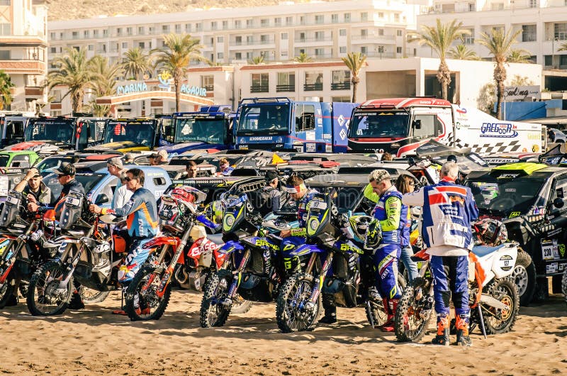 Motorbikes Lined Up on the Beach with Countless Rally Raid Vehicles ...