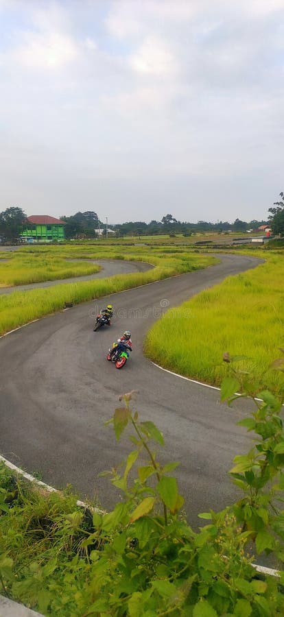 2 Motorbikes Were Racing on the Circuit in the Afternoon Stock Image ...