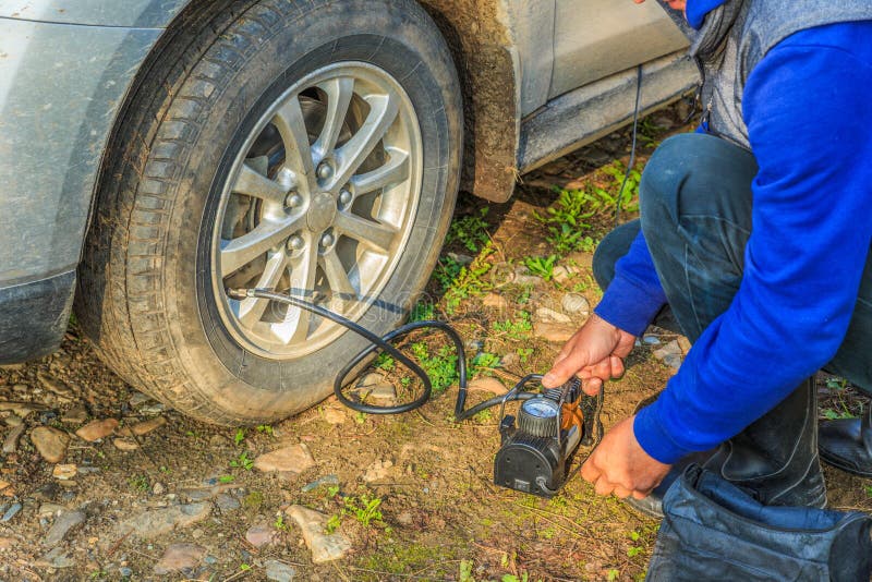 Pumping a Car Wheel with a Compressor Stock Image - Image of pump ...