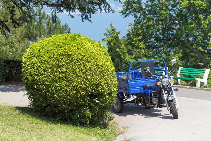 Motorcycle in the Botanical Garden Stock Photo - Image of plants ...