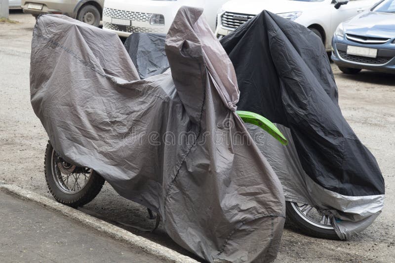 Motorcycle Case. a Motorcycle Covered with a Cover Near the House Stock ...