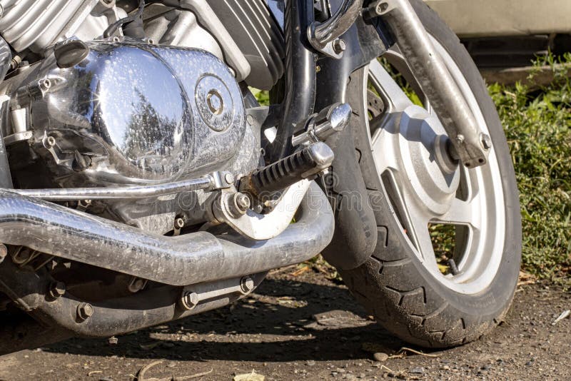 Motorcycle on a Dirt Road, Engine Parts and Front Wheel Stock Photo ...