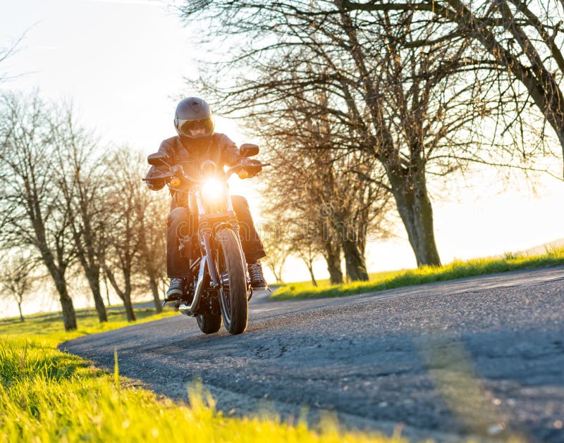 Motorcycle driver on road stock photo. Image of leather - 85245596