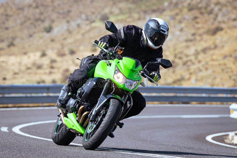 Motorcycle Driver Taking a Curve Editorial Stock Photo - Image of ...