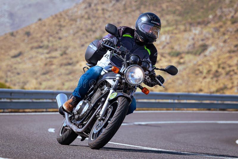 Motorcycle Driver Taking a Curve Editorial Stock Photo - Image of ...
