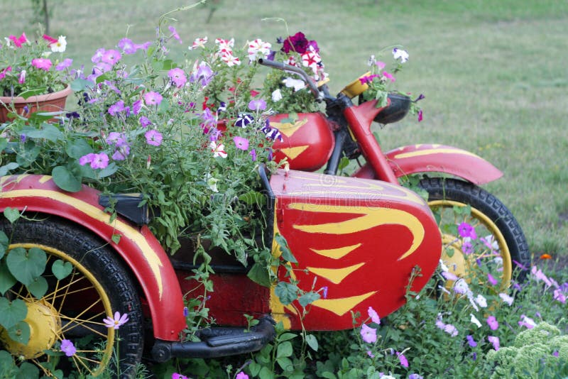 Motorcycle with flowers stock photo. Image of vintage - 117728422