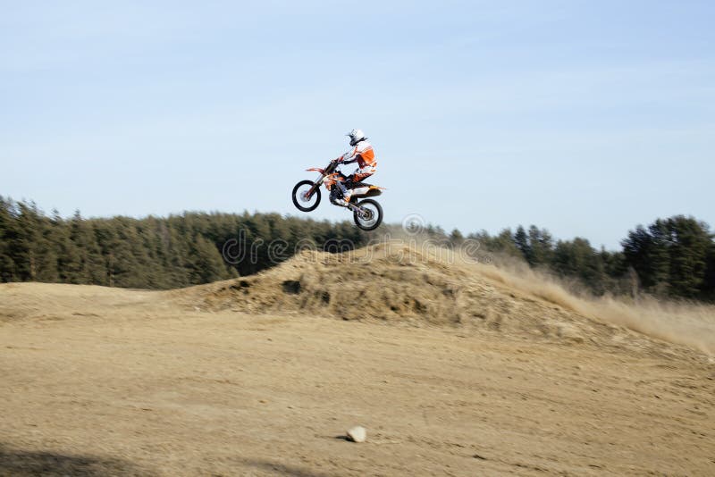 Stuntman on Motorbike Flying Over Cliff Stock Photo - Image of looking ...