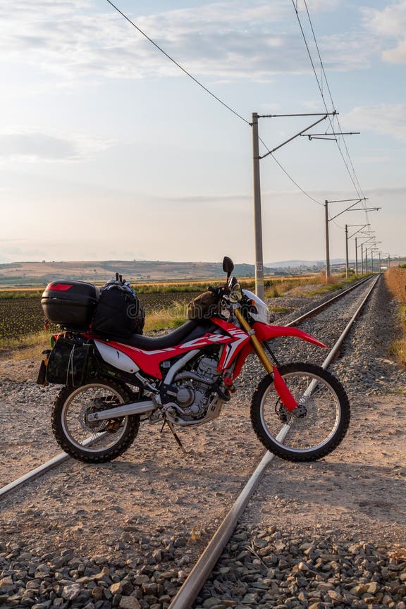 Motorcycle Loaded on the Bag, on Train Tracks Editorial Photography ...