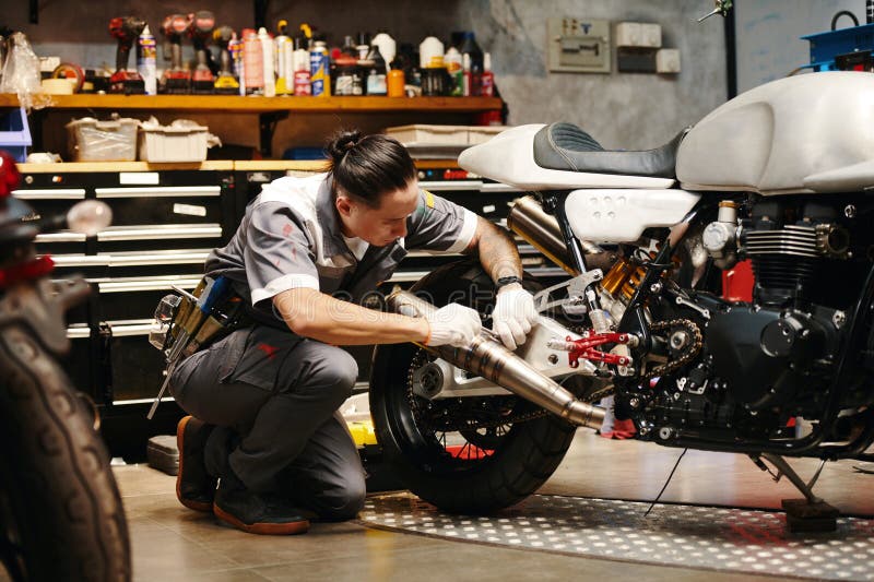 Motorcycle Mechanic Diagnosing and Fixing Problems Stock Image - Image ... Motorcycle Mechanic Diagnosing and Fixing Problems Stock Image - Image ...