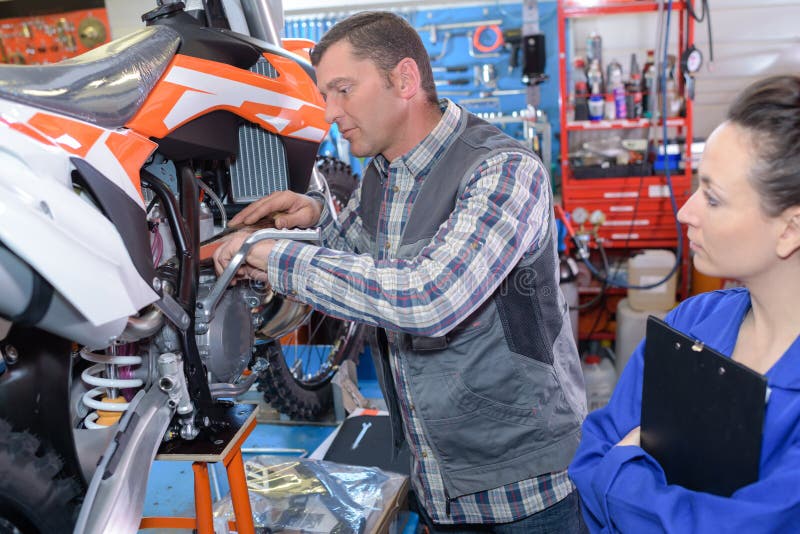 Motorcycle Mechanic Fixing Motorbike Stock Photo - Image of hand ...
