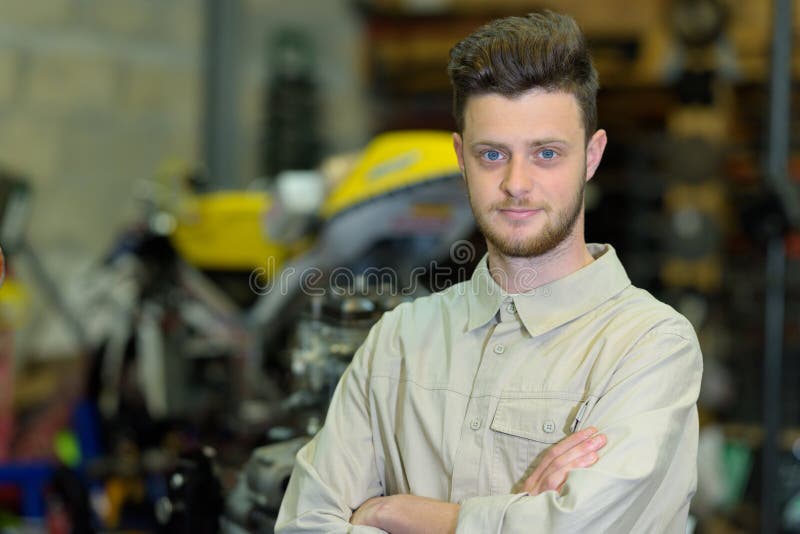 Motorcycle Mechanic Looking at Camera Stock Image - Image of service ...