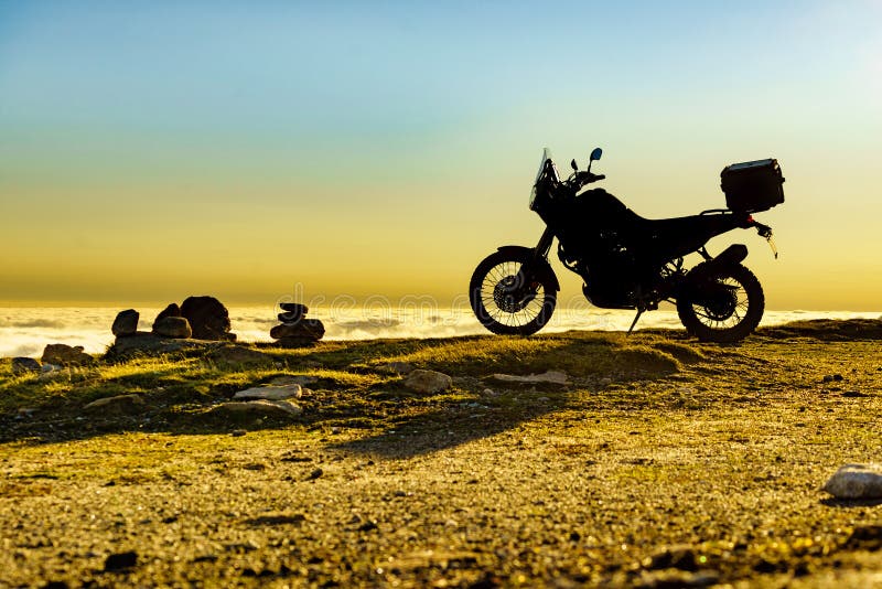 Motorcycle on mountain top stock photo. Image of ride - 356542496