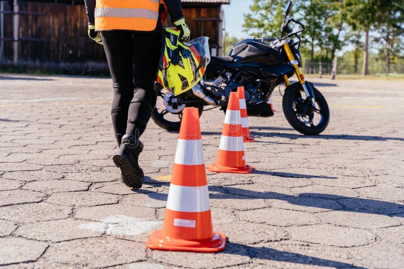 The Motorcycle is Parked in a Row of Orange Cones. Motorcycle Driving ...