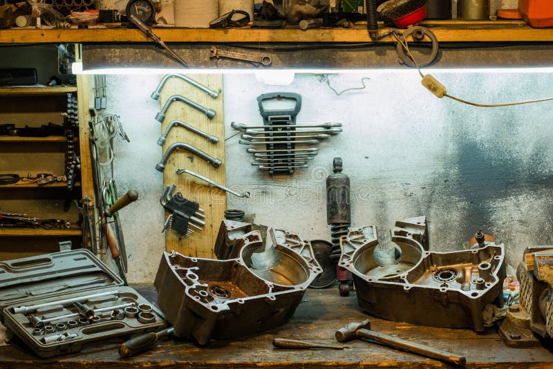 Motorcycle Parts and Tools on the Desktop in Garage Stock Photo - Image ...