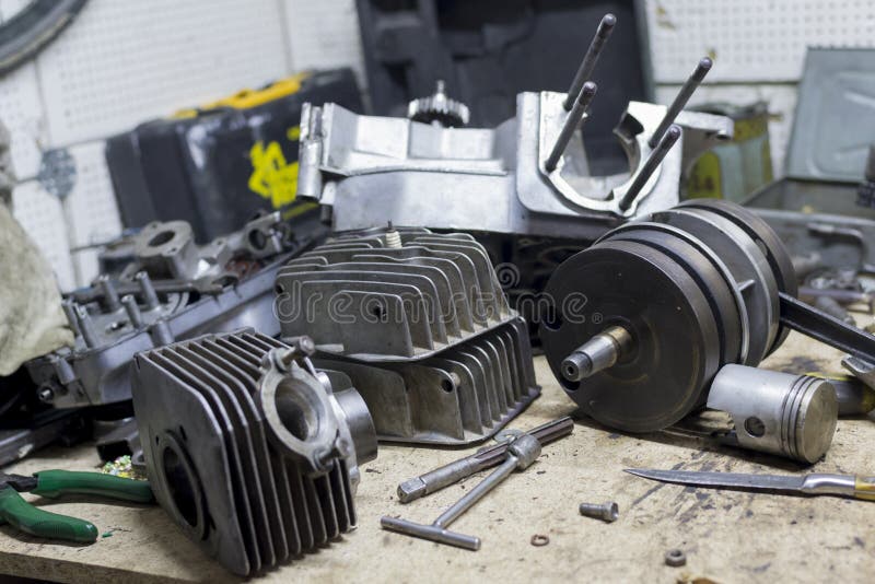 Motorcycle Parts and Tools on the Desktop in Garage Stock Photo - Image ...
