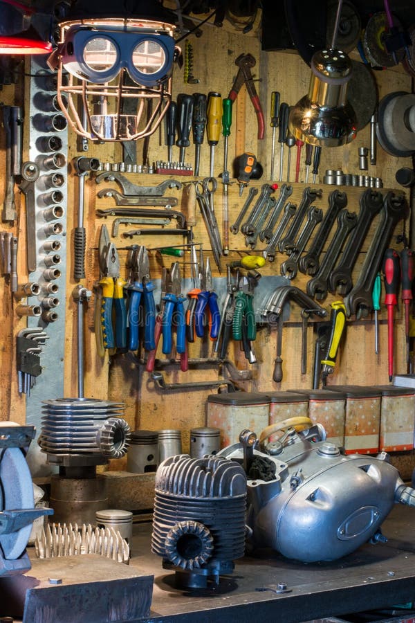 Motorcycle Parts and Tools on the Desktop in Garage Stock Image - Image ...