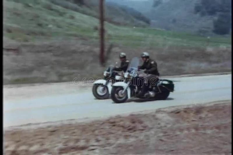 Police Car Chasing Man in Station Wagon on Country Road Stock Footage ...