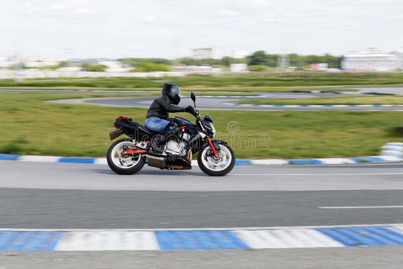 A Motorcycle Racer Makes a Practice Run on a Sports Track Stock Photo ...