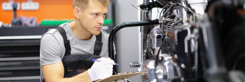 A Motorcycle Repairman Takes Notes Close Up Stock Image Image Of Retro Ride 259098867