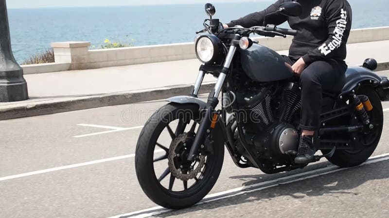 Motorcycle Rider Moving Fast in the Street by the Beach Stock Footage ...