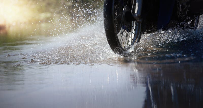 Motorcycle Run through Flood Water after Hard Rain with Water Spray ...