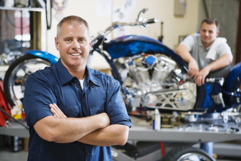 Mechanic Repairing Motorcycle at Garage Editorial Photo - Image of ...