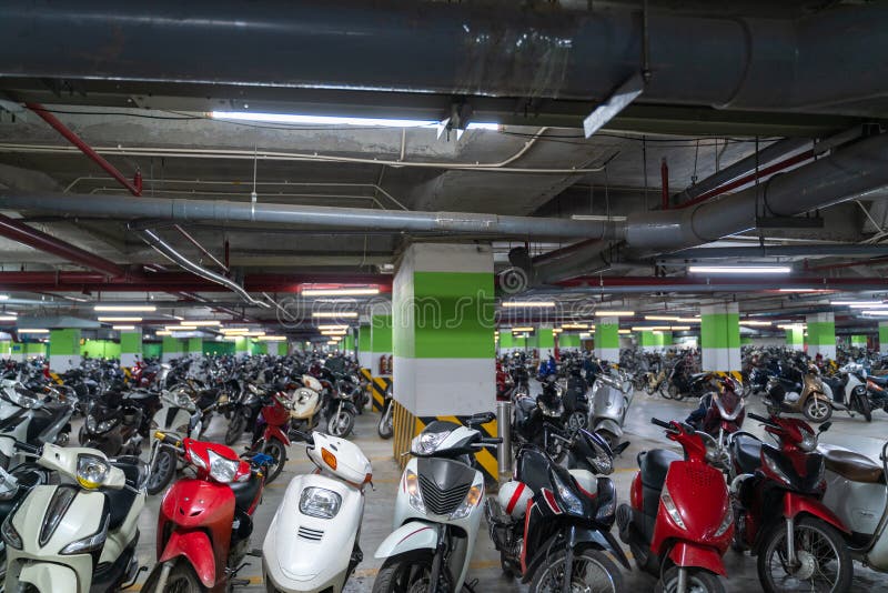 Motorcycles and Scooters Park in the Underground Basement Parking of ...