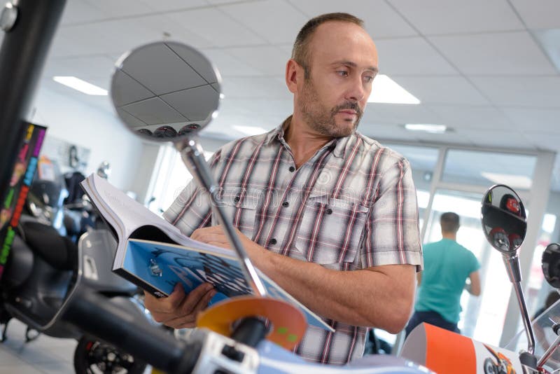 He at motorcycles store stock image. Image of parking - 261515161