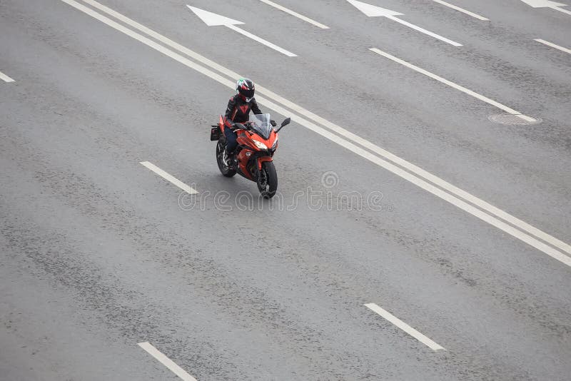 Motorcyclist Rides a Motorcycle on a Multi-lane Highway Stock Photo ...
