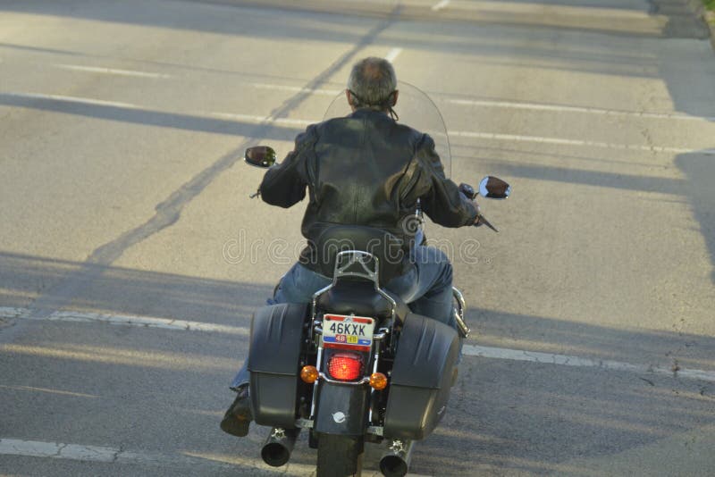 Motorcyclist Riding Down the Street Editorial Stock Image - Image of ...