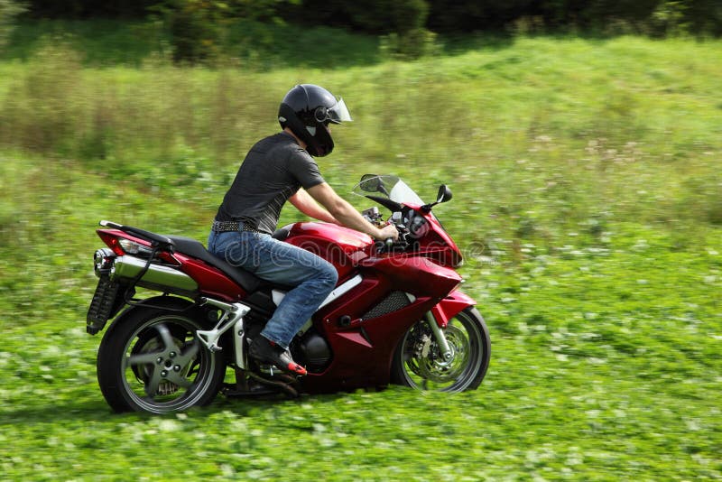 Motorcyclist Riding on Meadow Stock Image - Image of driver, vehicle ...