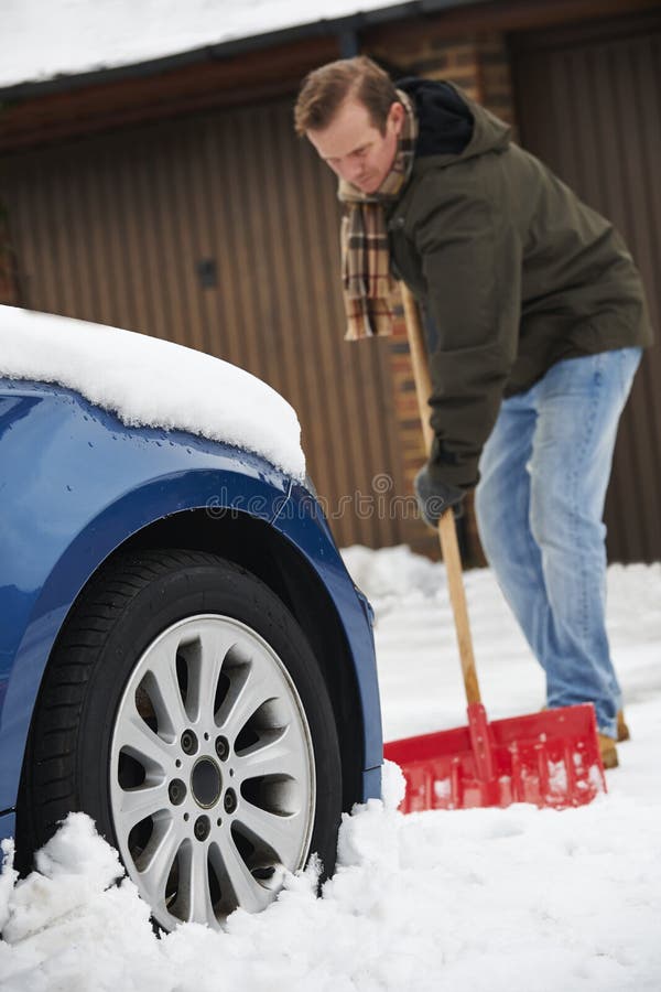 Motorist Digging Car Out of Snow Stock Photo - Image of vertical ...