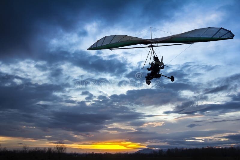 Hang glider in the sunset stock image. Image of flight - 67007831