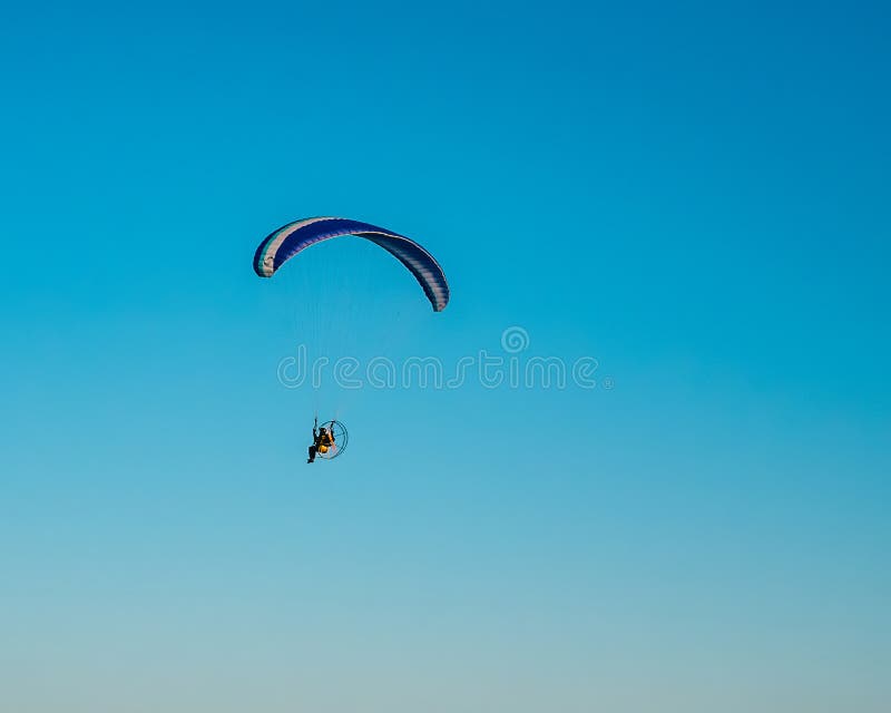Motorized Paraglider in a Blue Clear Sky Stock Photo - Image of outdoor ...